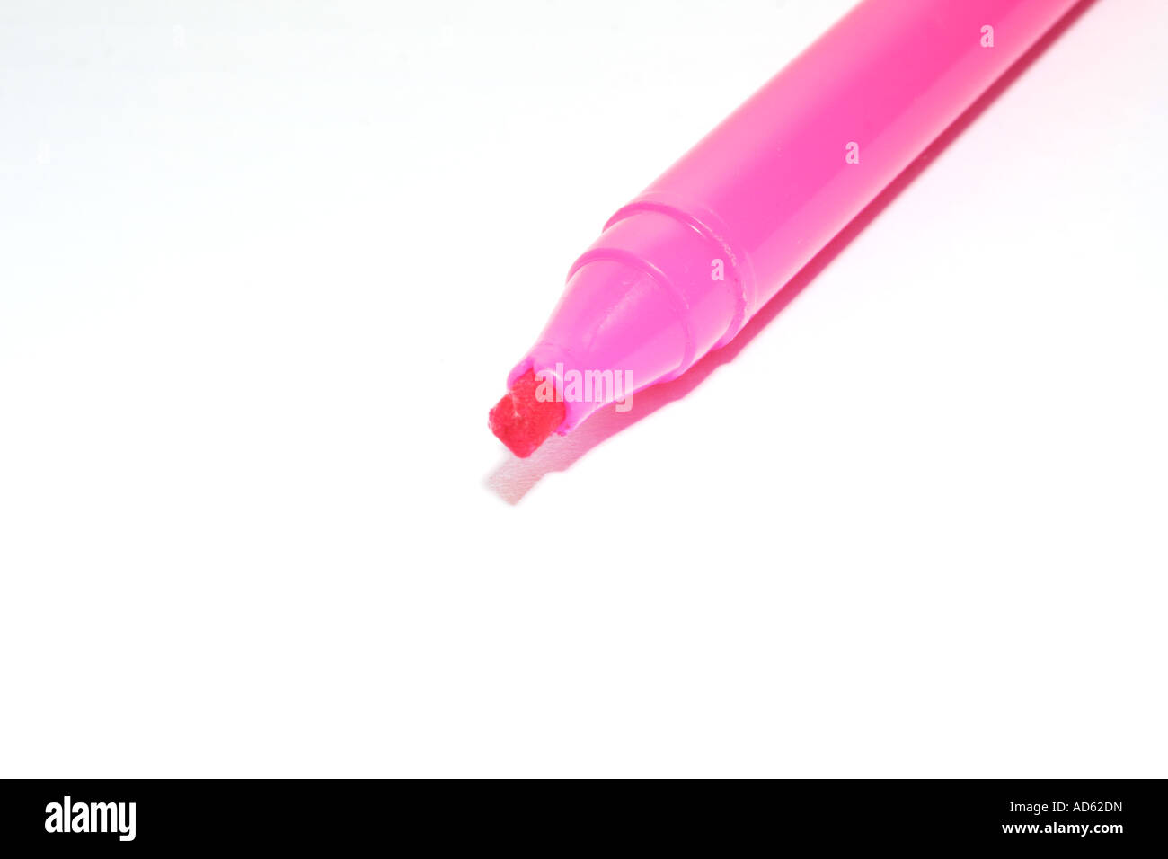 A close-up of a pink highlighter marker with its tip visible, isolated ...