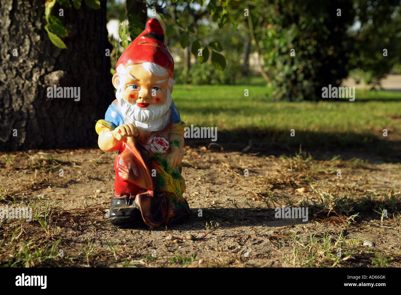 garden gnome, figurine in a garden Stock Photo - Alamy