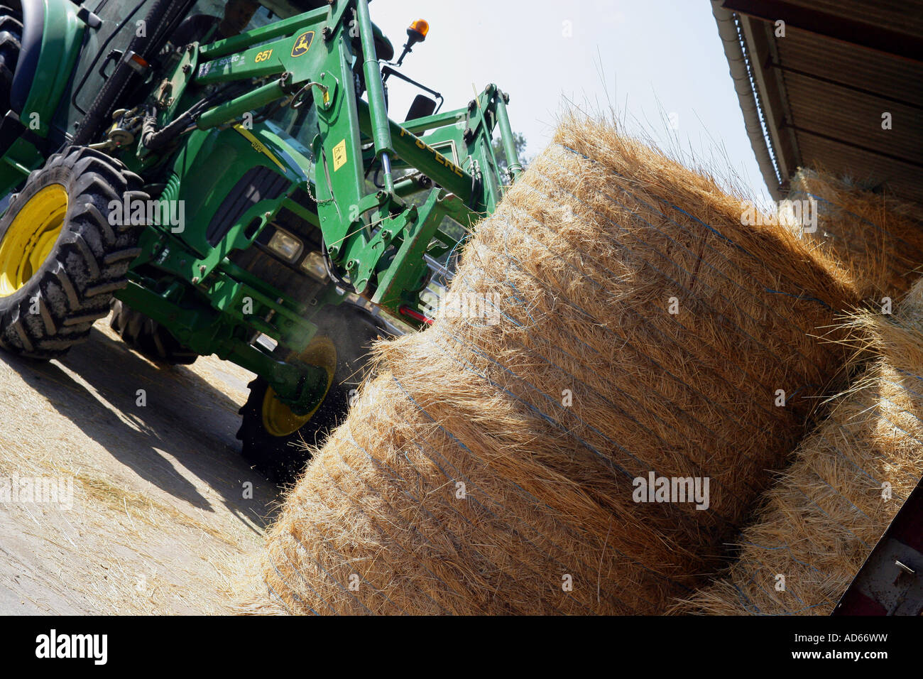 hay bunches and tractor Stock Photo - Alamy