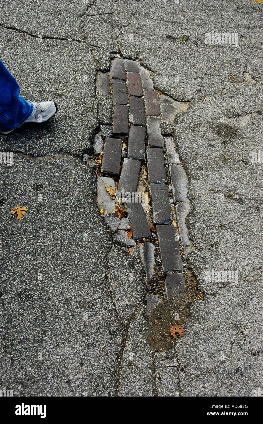walking on broken pavement Stock Photo - Alamy