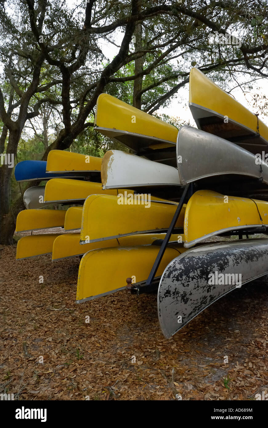 camp canoes stacked on rack Stock Photo - Alamy