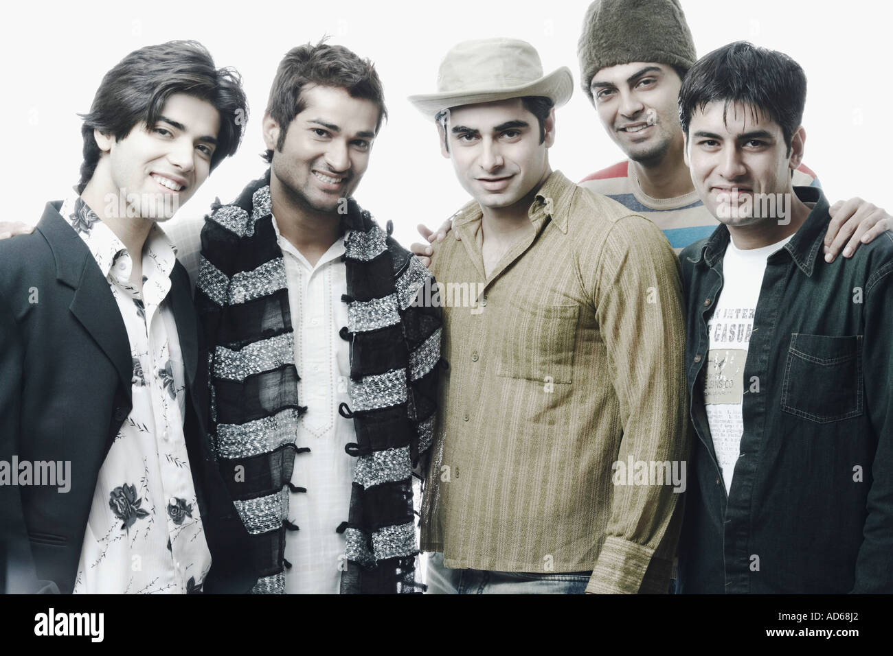 Portrait of a group of young men smiling Stock Photo - Alamy