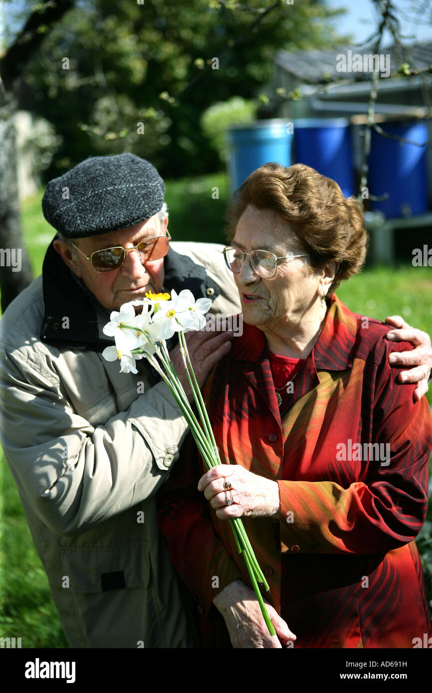 elderly persons with flowers Stock Photo - Alamy
