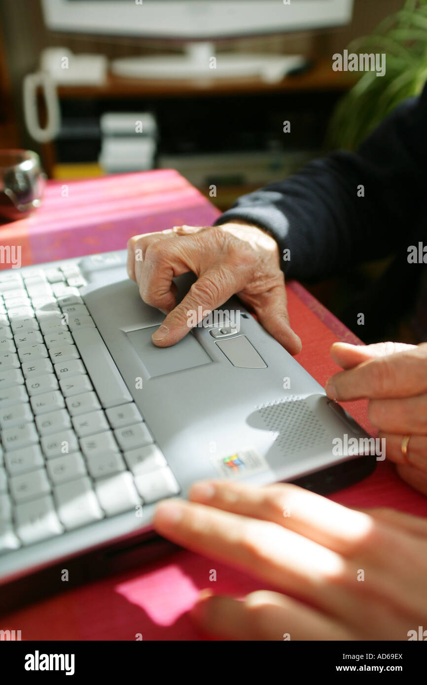 elderly person with laptop computer Stock Photo - Alamy