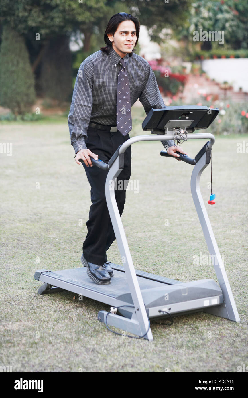 Businessman running on treadmill business hi-res stock photography and ...