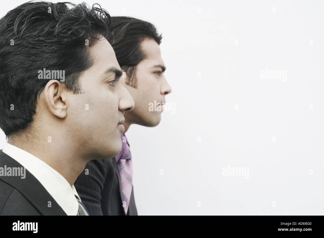 Side profile of two businessmen Stock Photo - Alamy