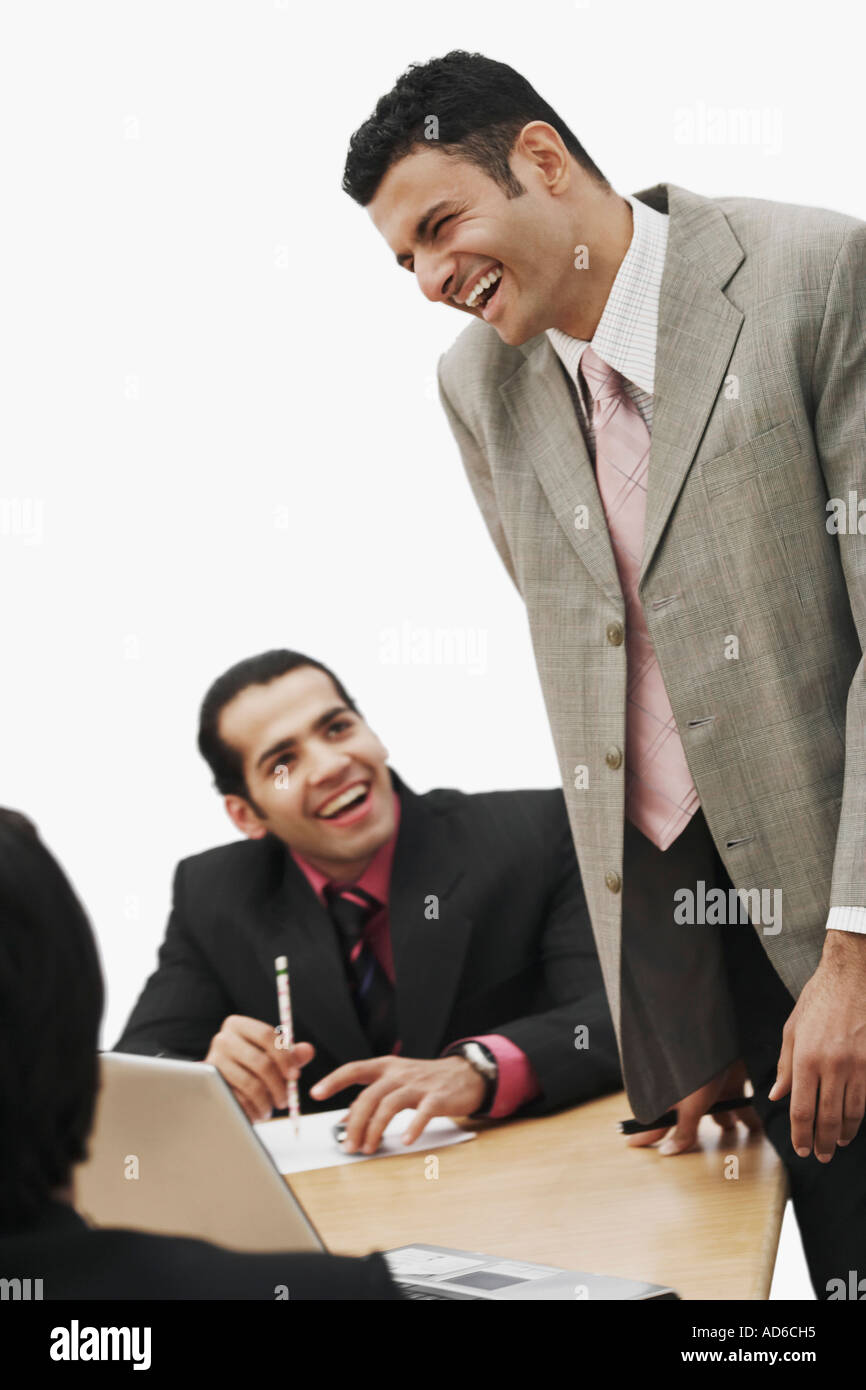 Two businessmen laughing in a conference room Stock Photo - Alamy