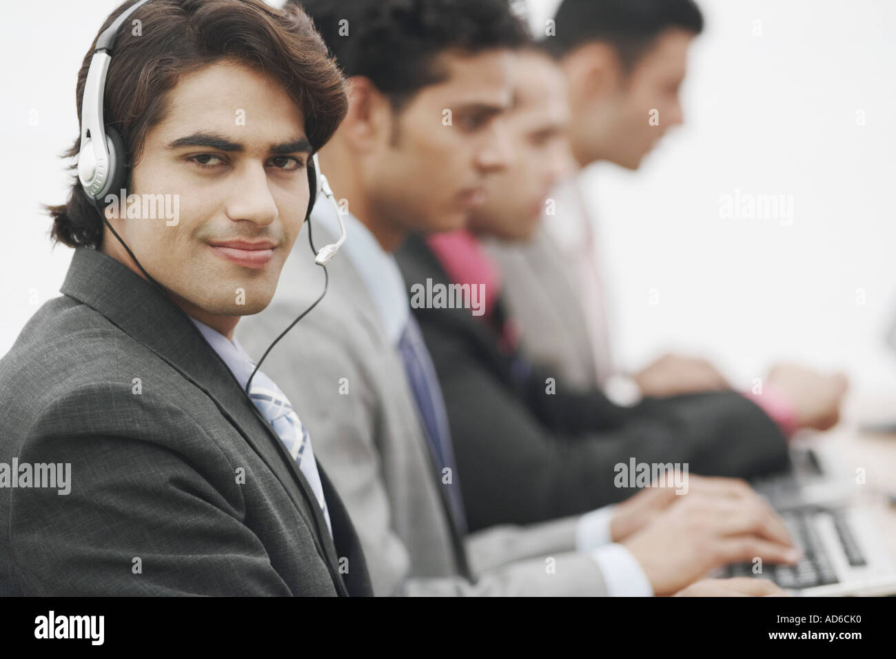 Man wearing headset typing in hi-res stock photography and images - Alamy