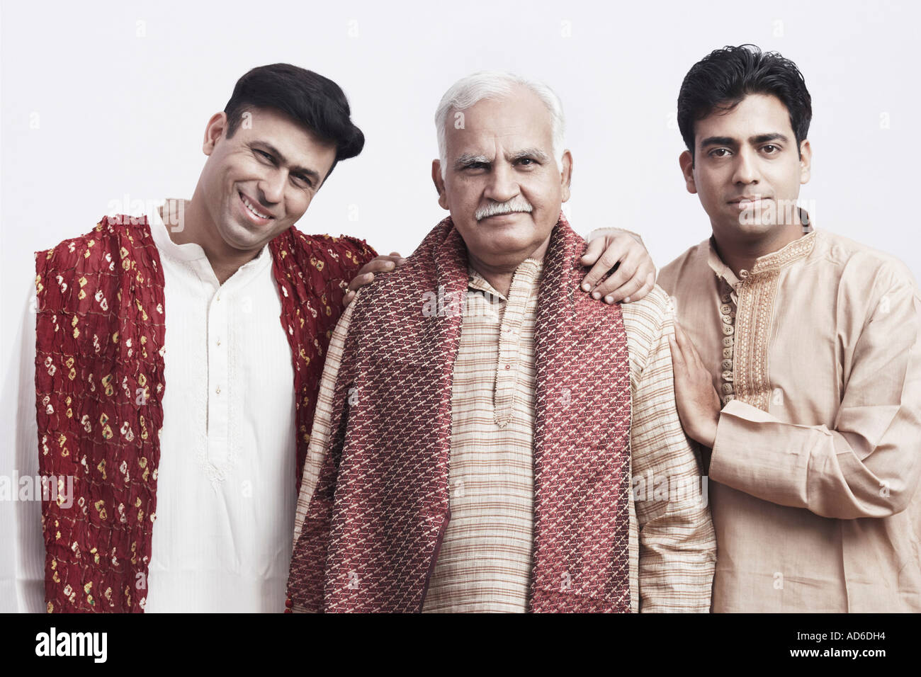 Portrait of a father and his two sons smiling Stock Photo - Alamy