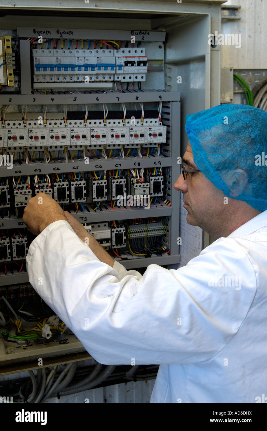 Electrical engineer working on electrical panel Stock Photo - Alamy