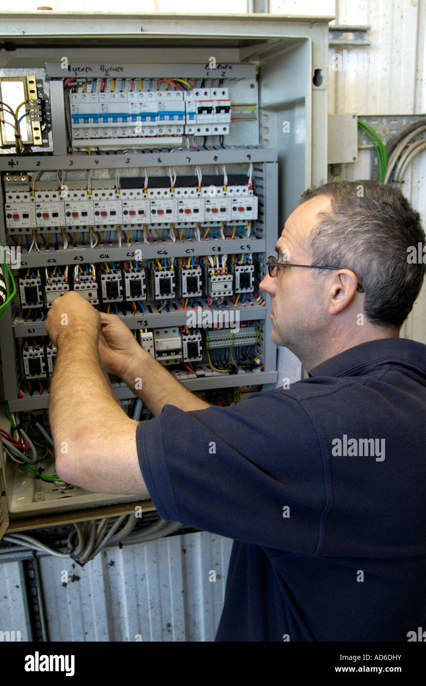 Electrical engineer working on electrical panel Stock Photo - Alamy