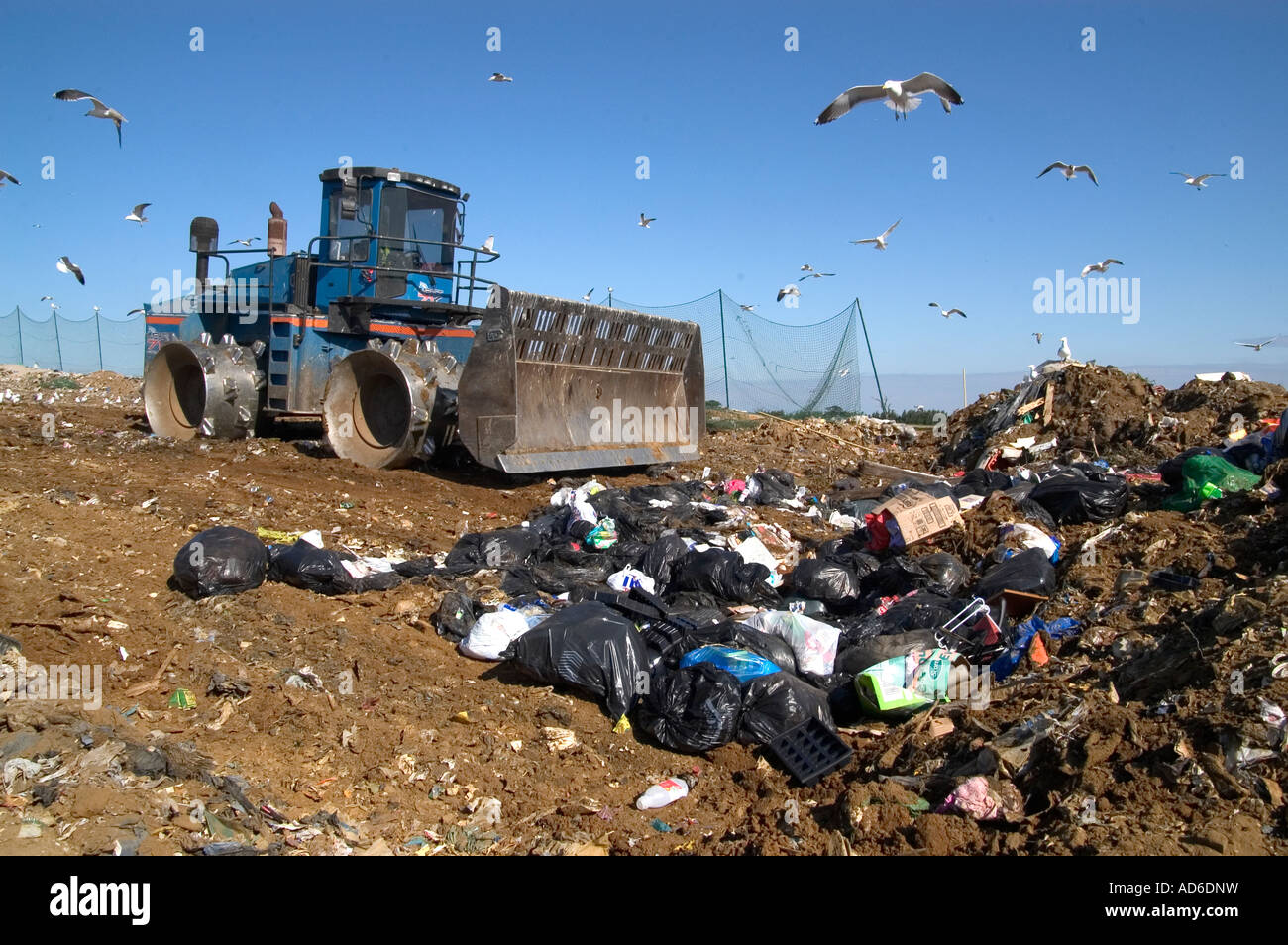 Machine working on landfill site UK Stock Photo - Alamy