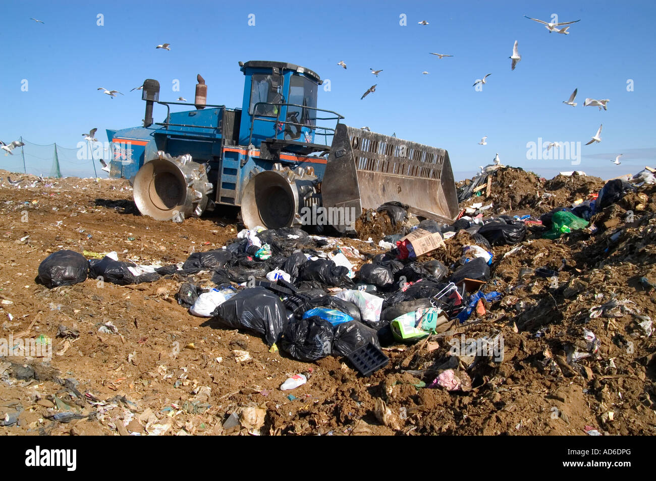Machine working on landfill site UK Stock Photo - Alamy