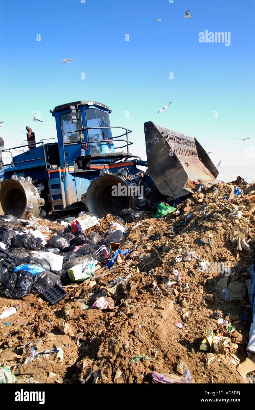 Machine working on landfill site UK Stock Photo - Alamy