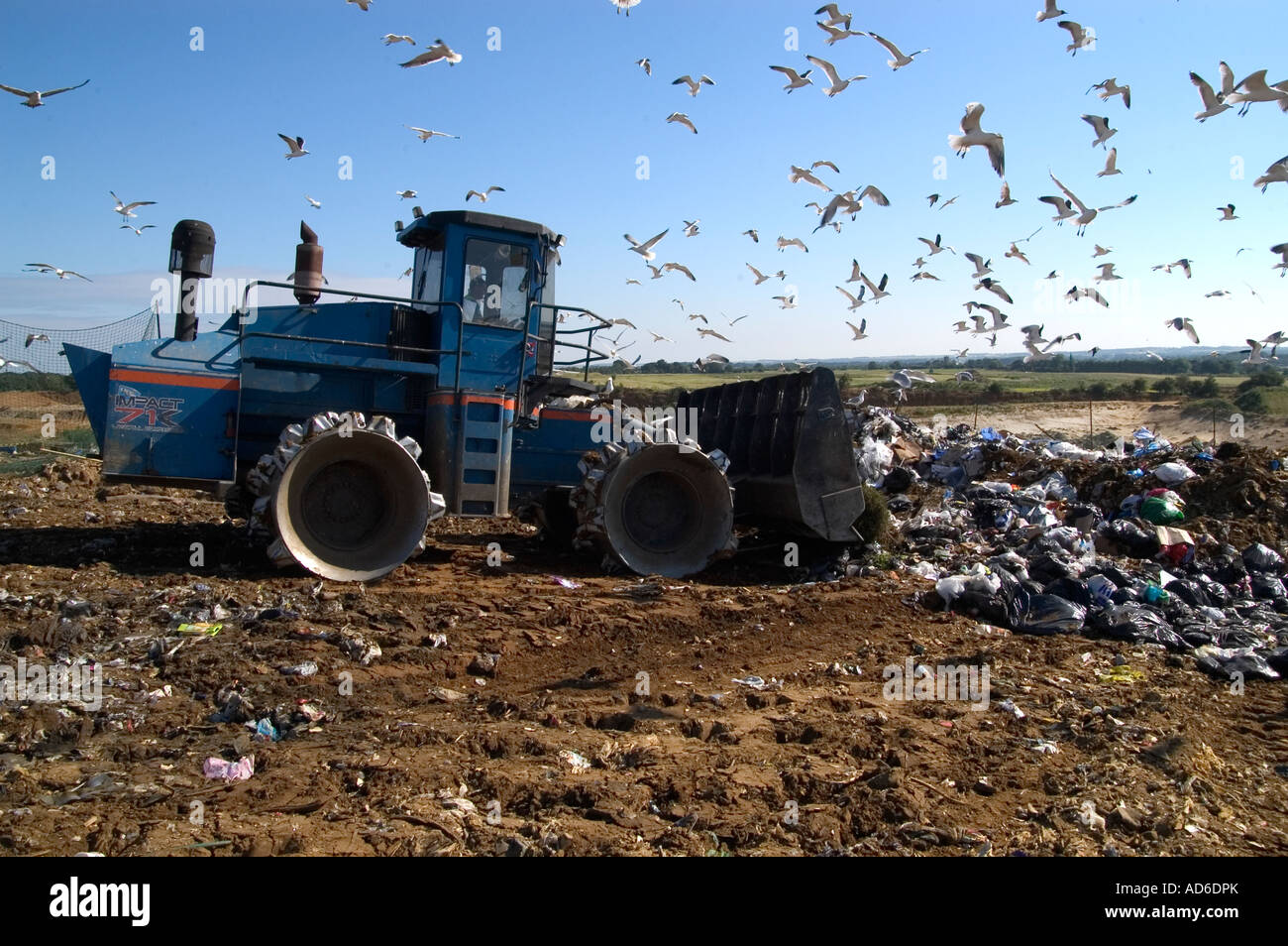 Machine working on landfill site UK Stock Photo - Alamy