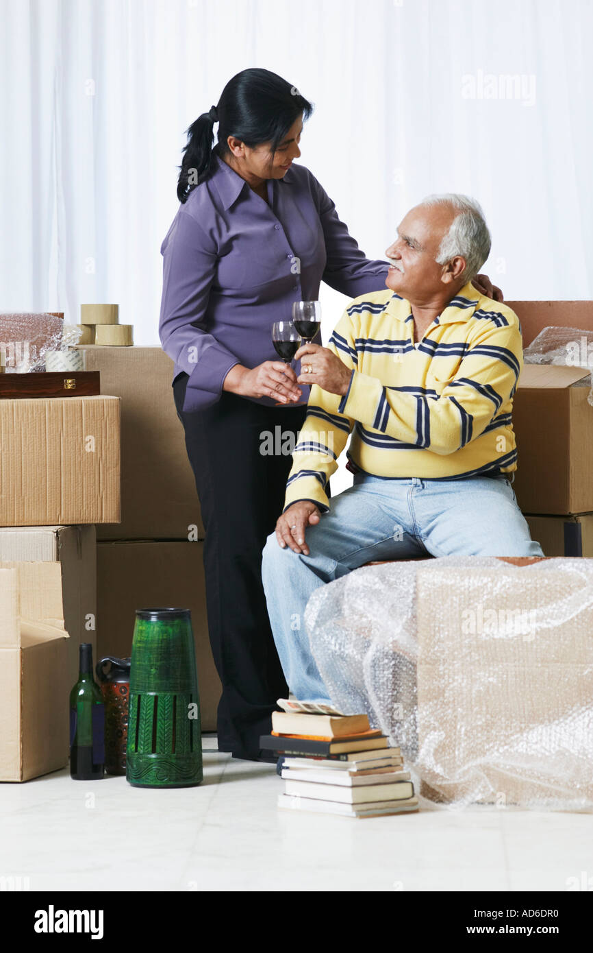Mature couple raising a toast Stock Photo - Alamy