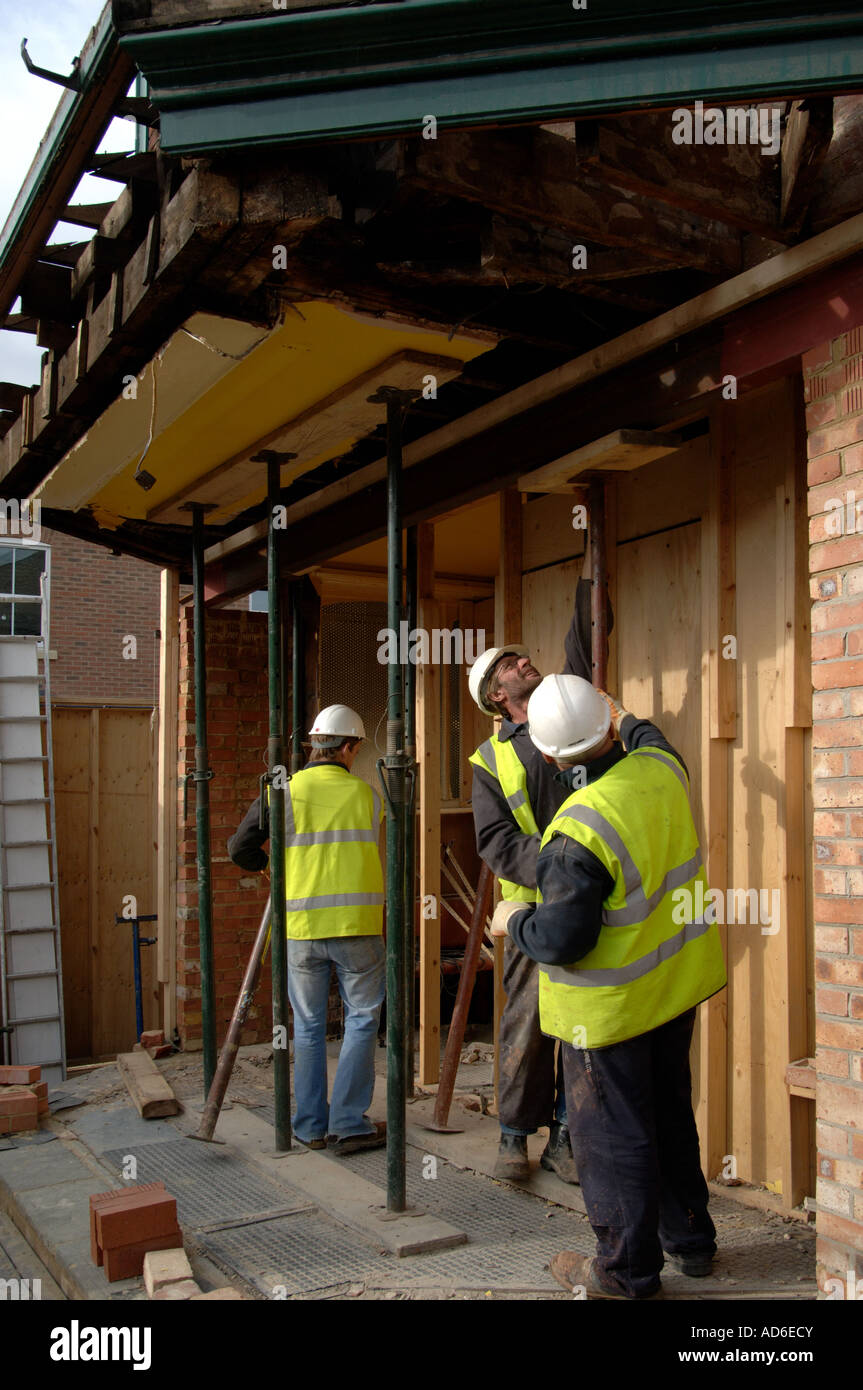Buliders fitting RSJ to renovate building Stock Photo - Alamy