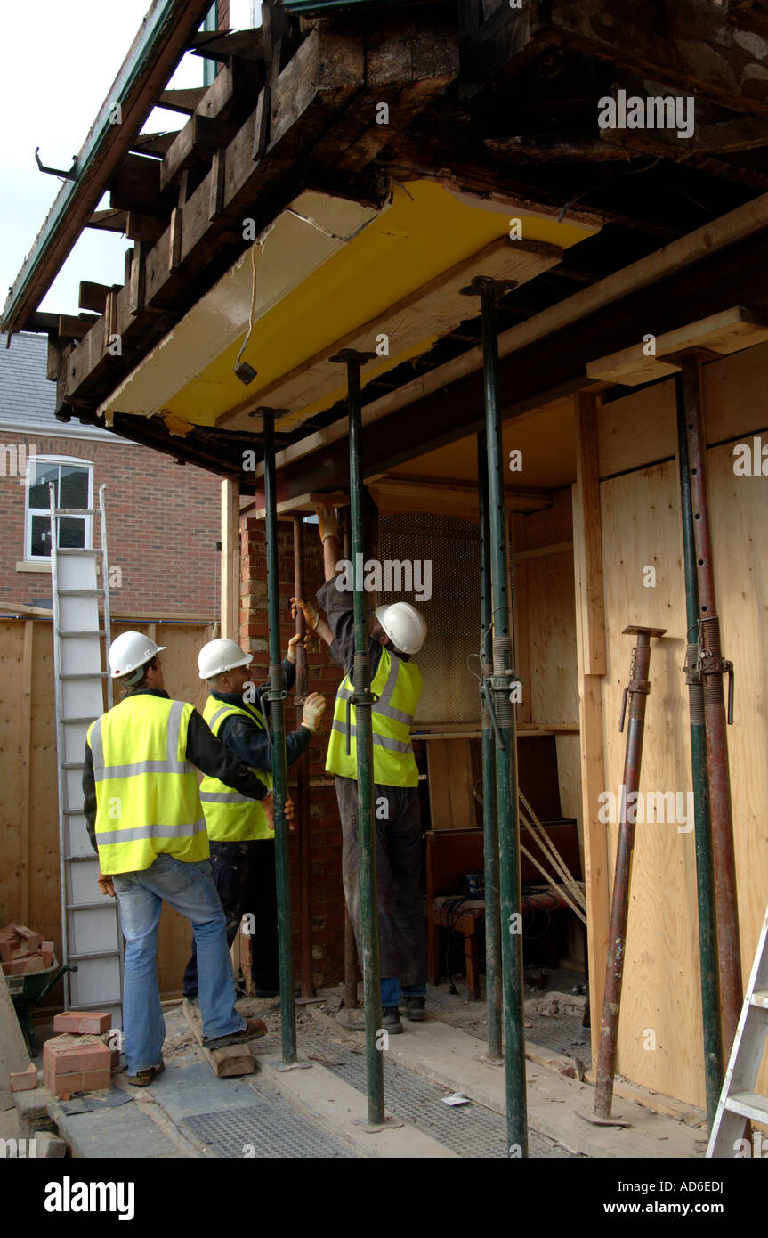Buliders fitting RSJ to renovate building Stock Photo - Alamy