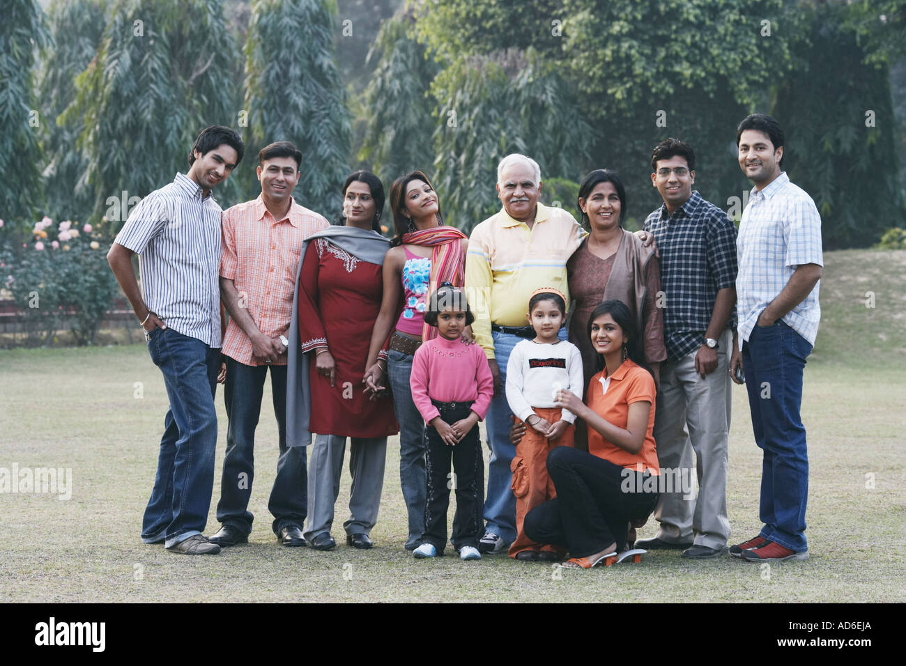 Portrait of a three generation family on a lawn Stock Photo - Alamy