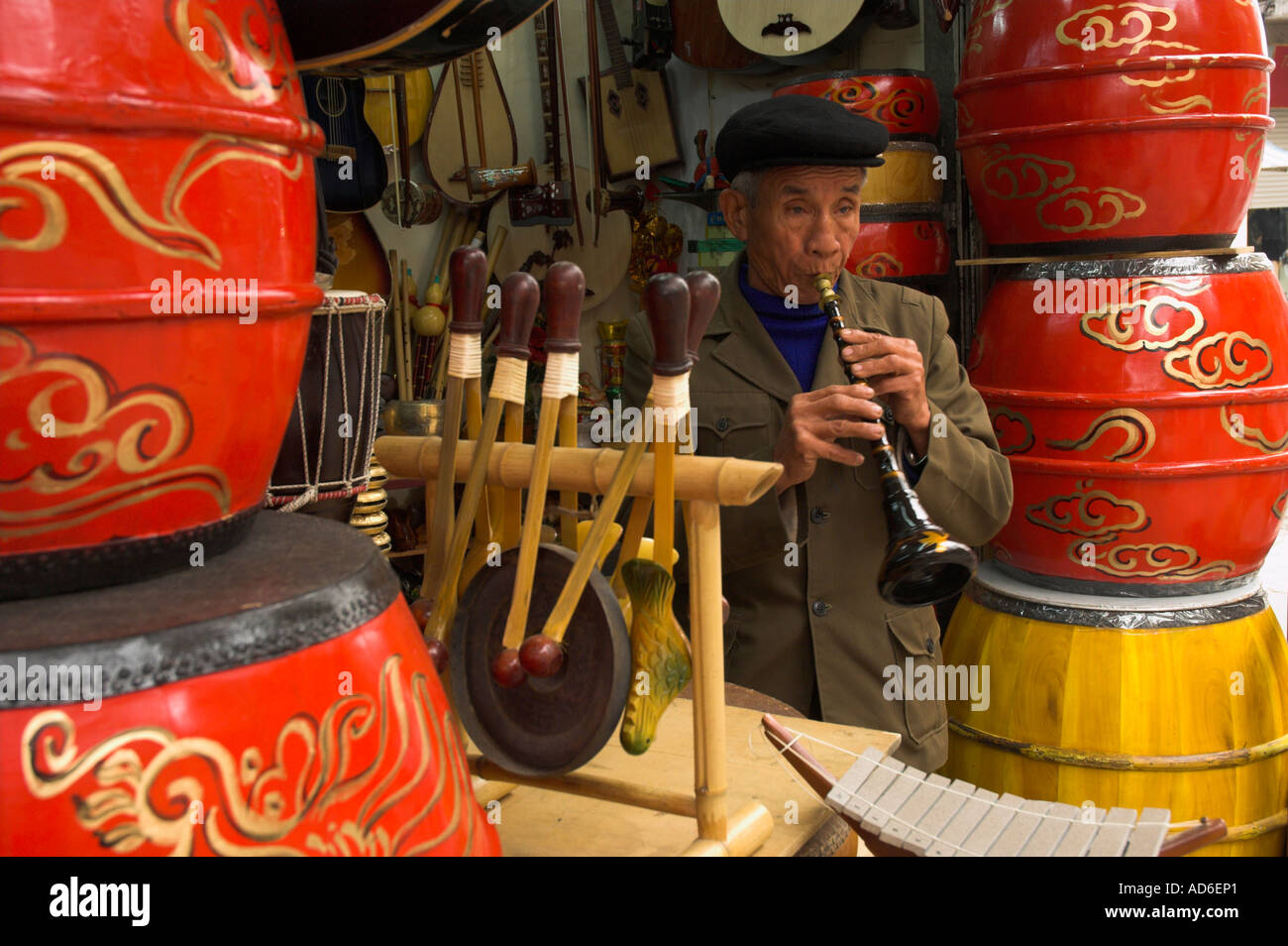 Old man playing flute in hi-res stock photography and images - Alamy
