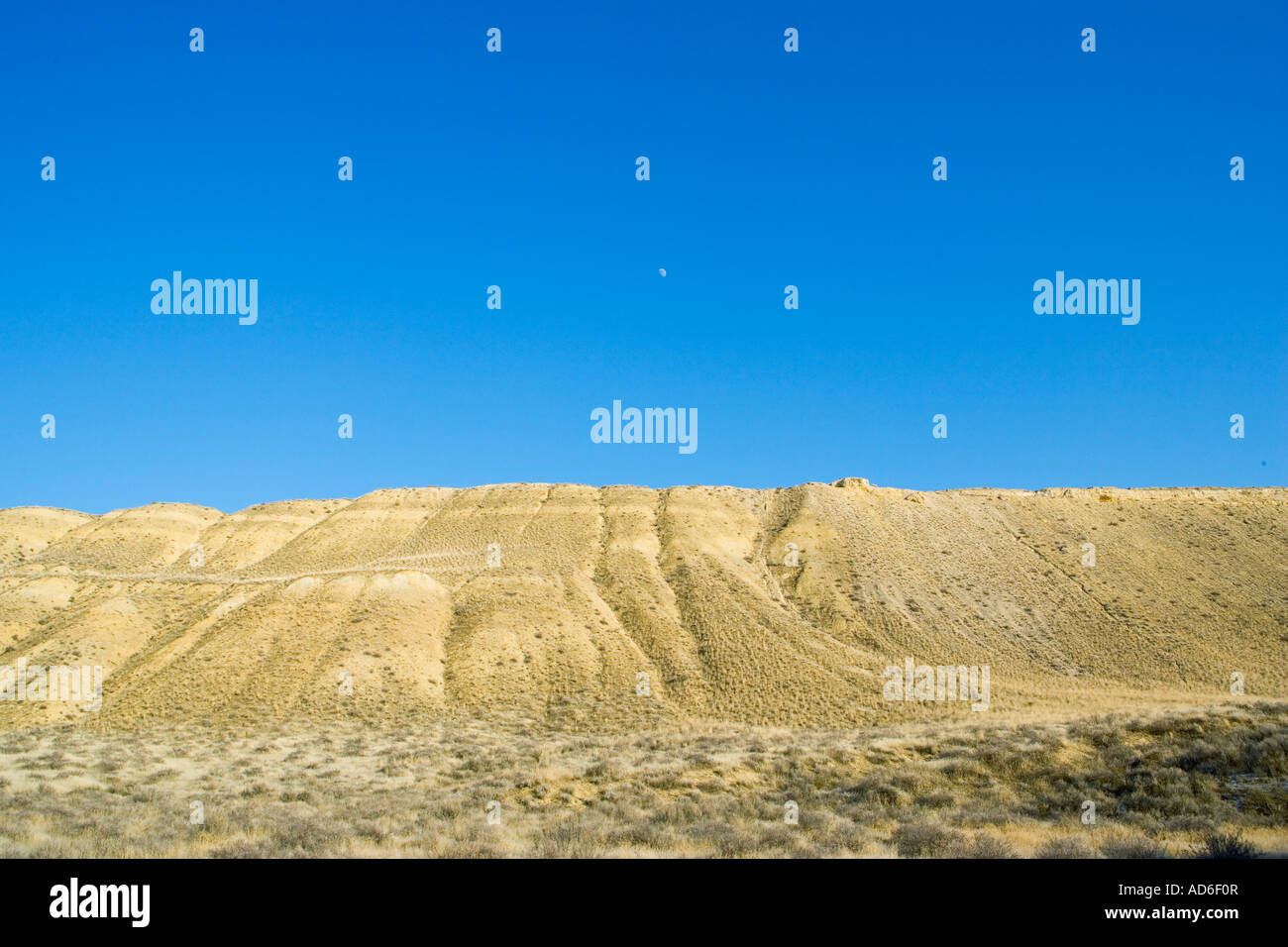Desert hillside with blue sky and moon in Southeastern Washington USA ...