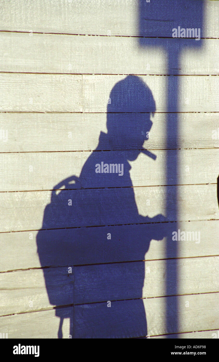 Man smoking in shadows hi-res stock photography and images - Alamy