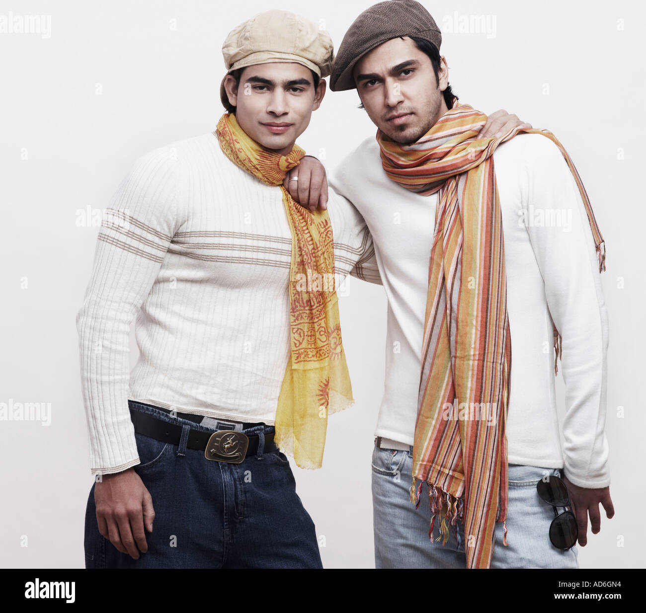 Portrait of two young men with their arms around each other Stock Photo ...