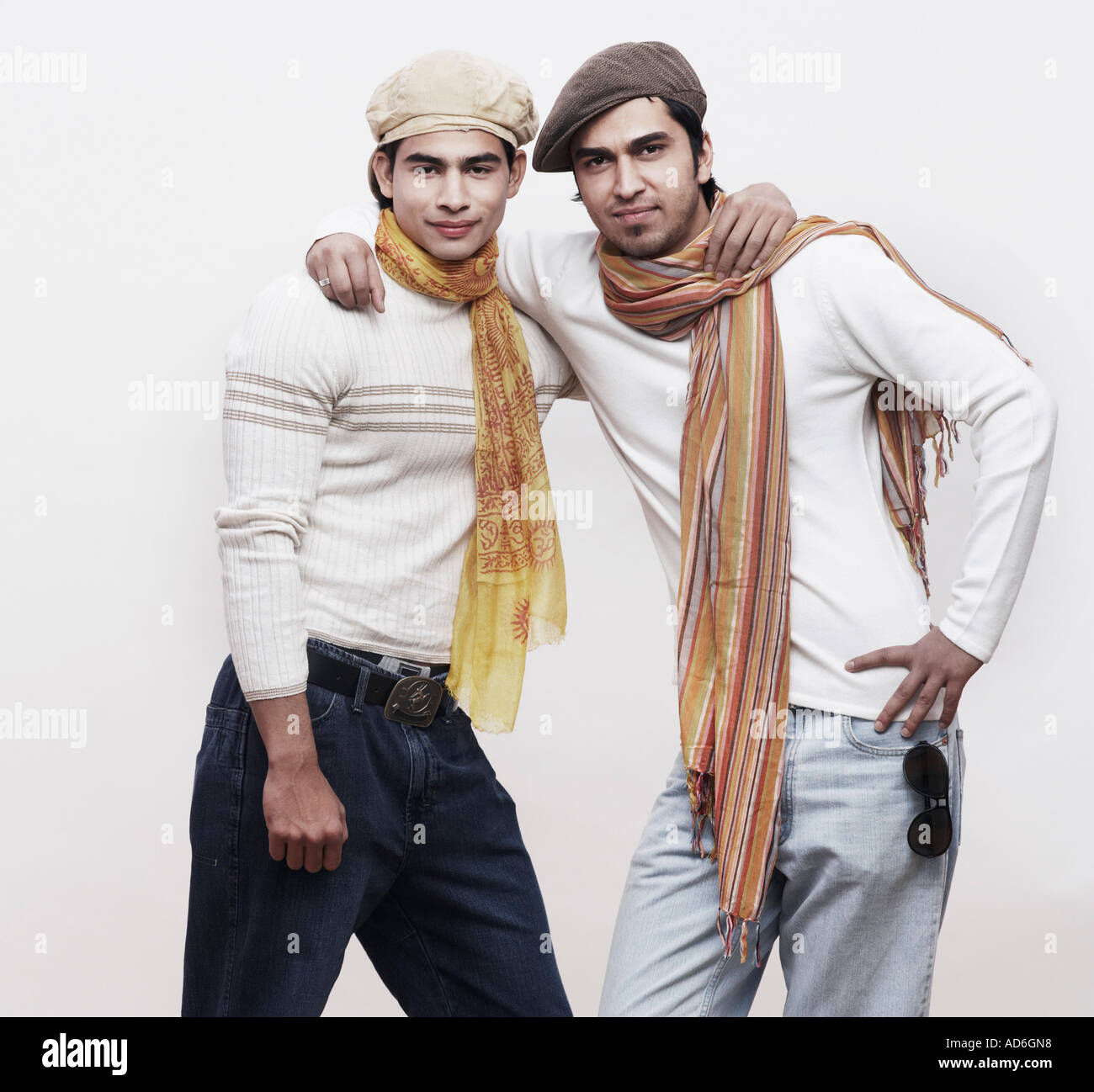 Portrait of two young men with their arms around each other Stock Photo ...