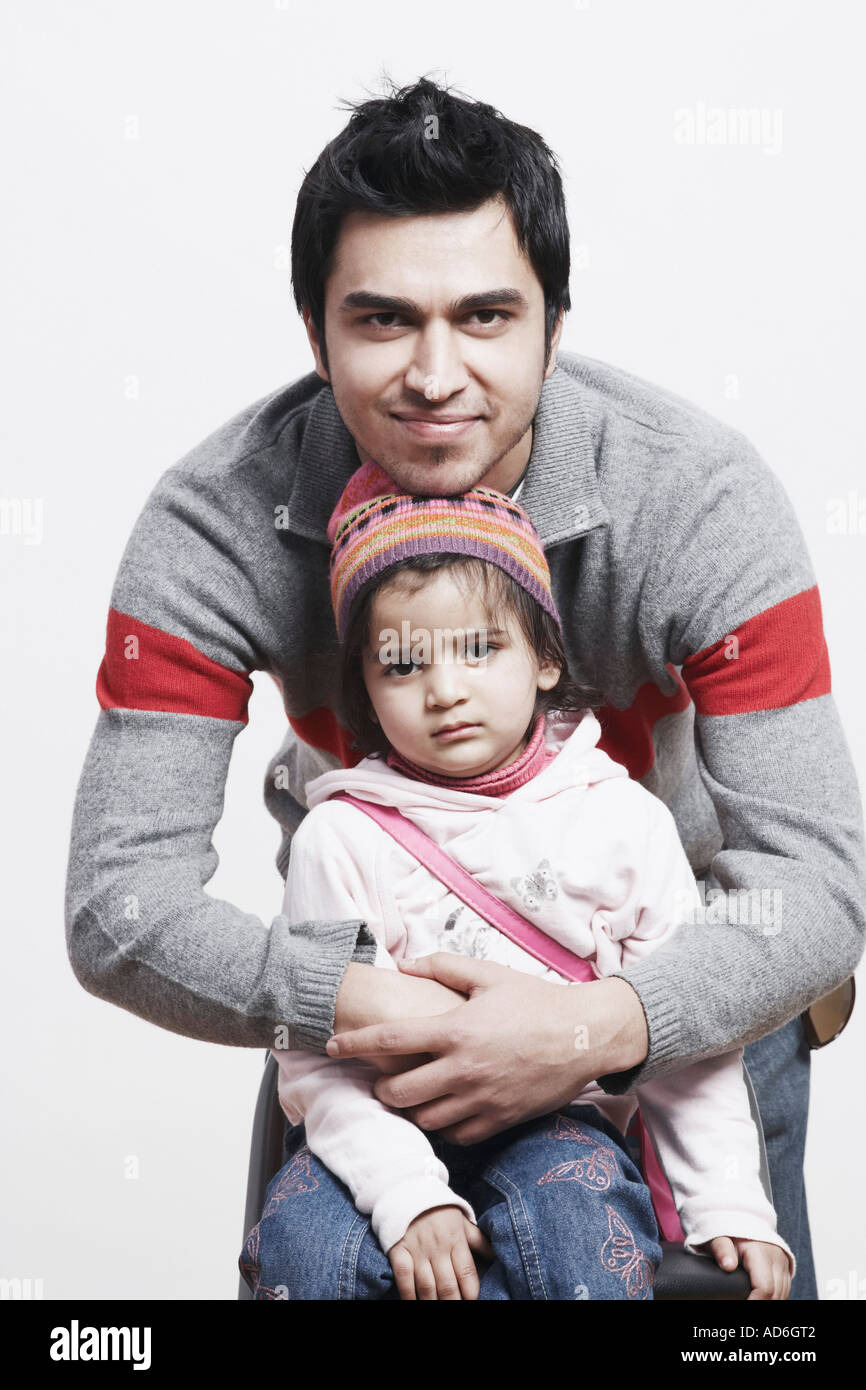 Portrait of a father hugging his daughter Stock Photo - Alamy