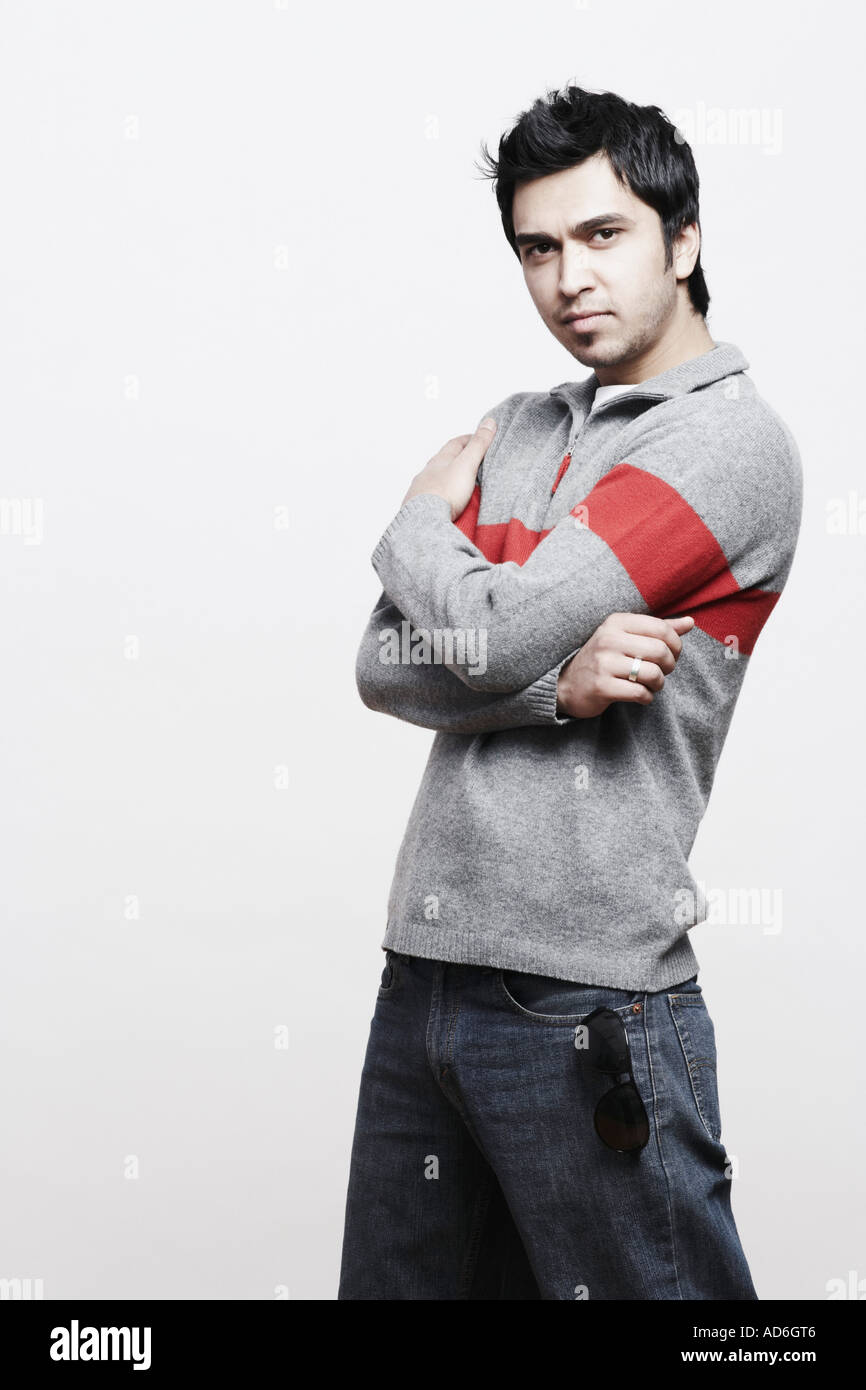 Portrait of a young man with his arms crossed Stock Photo - Alamy
