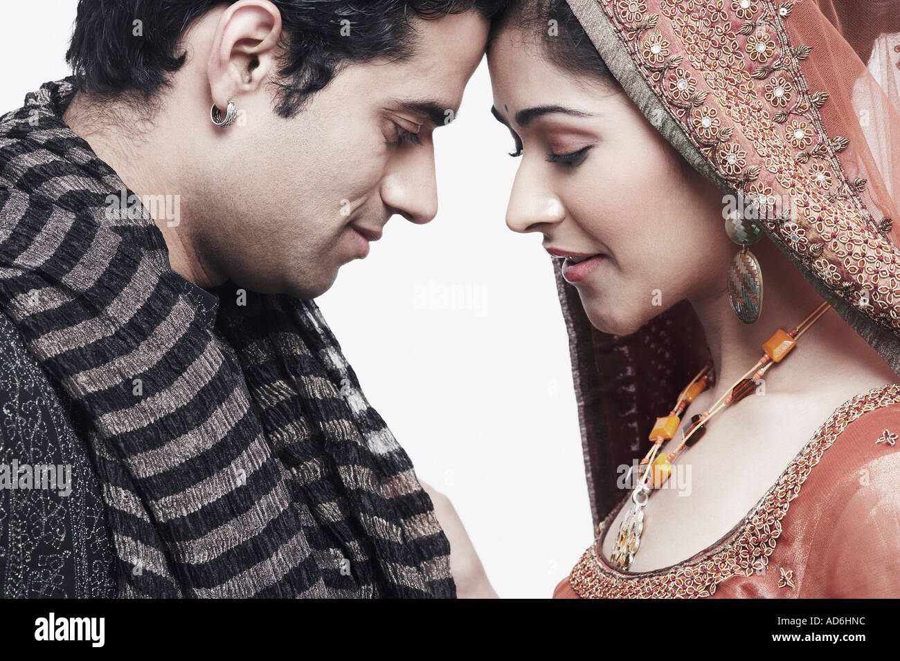 Side profile of a newlywed couple looking down Stock Photo - Alamy