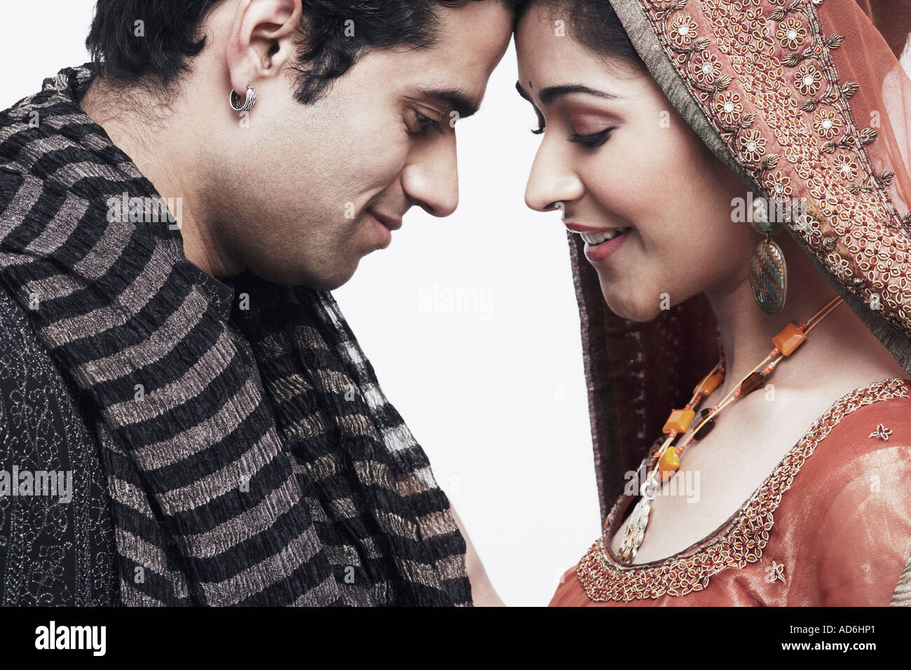 Side profile of a newlywed couple looking down Stock Photo - Alamy