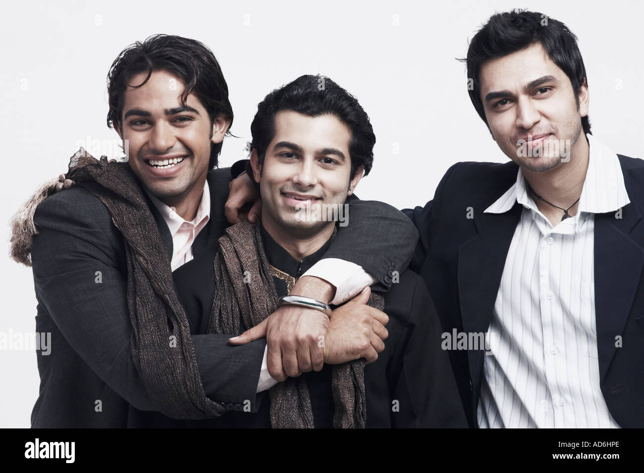 Portrait of three young men smiling Stock Photo - Alamy