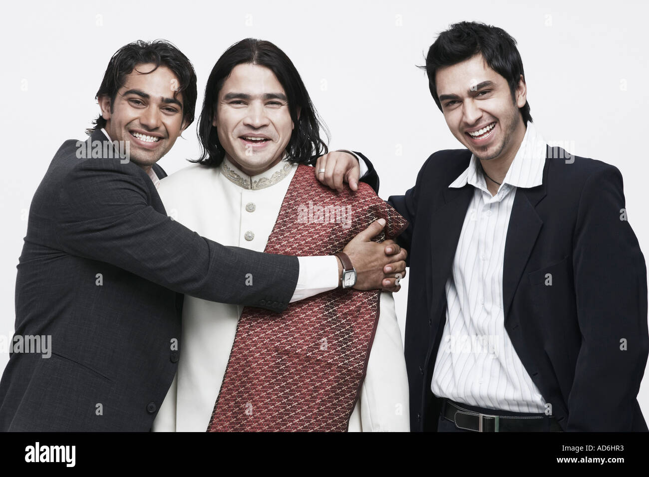 Portrait of three young men smiling Stock Photo - Alamy