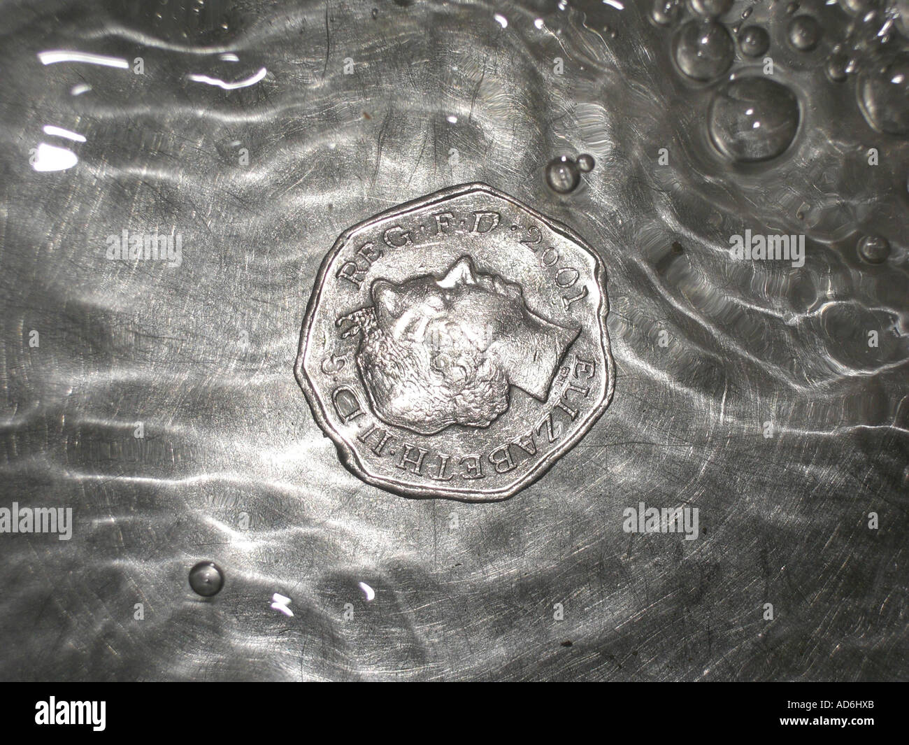 Coin under water hi-res stock photography and images - Alamy