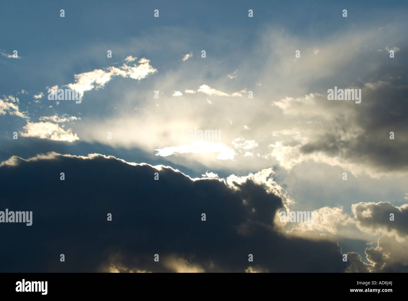 Dramatic storm clouds with rays of sun breaking through Stock Photo - Alamy