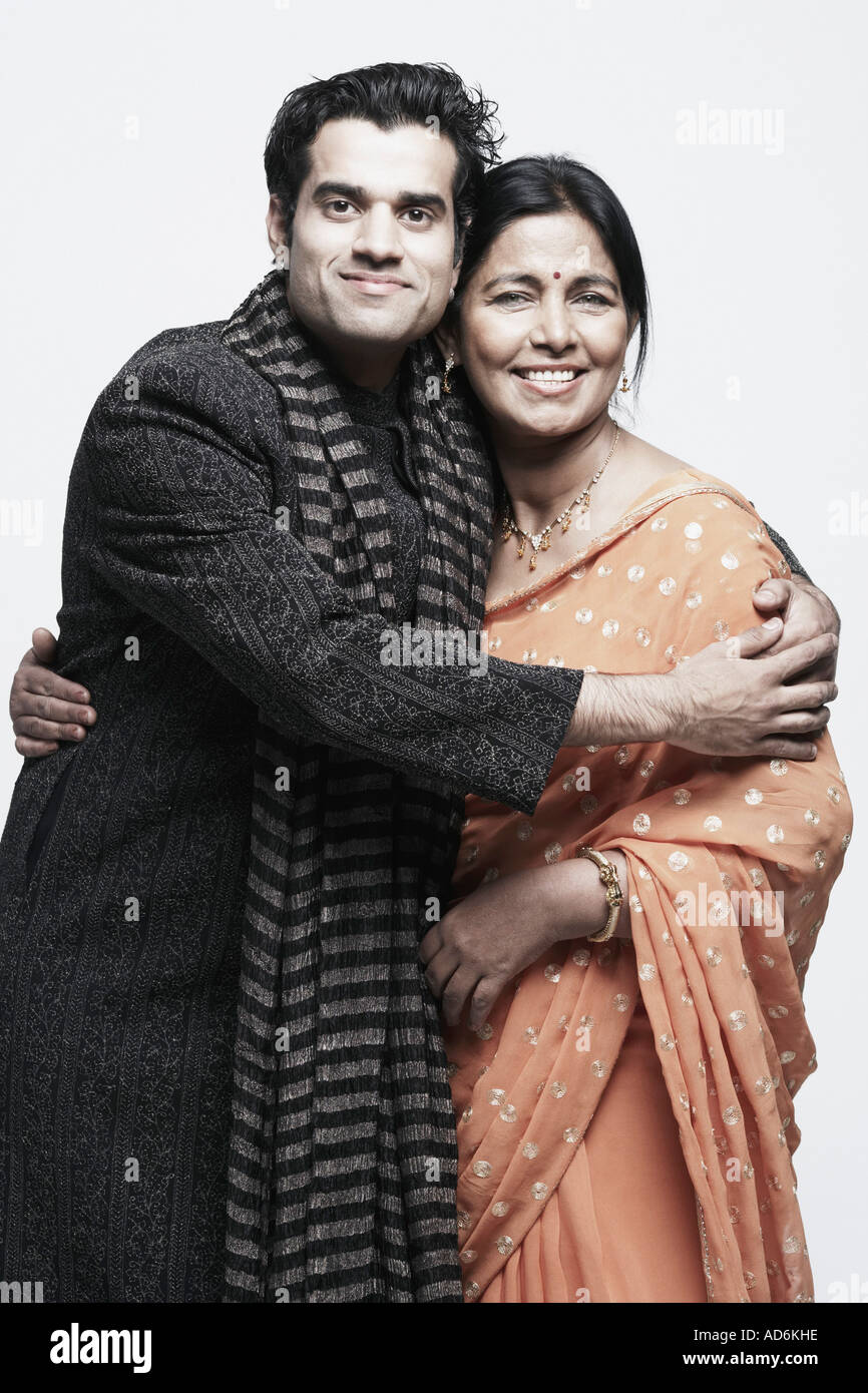 Portrait of a young man hugging his mother Stock Photo - Alamy