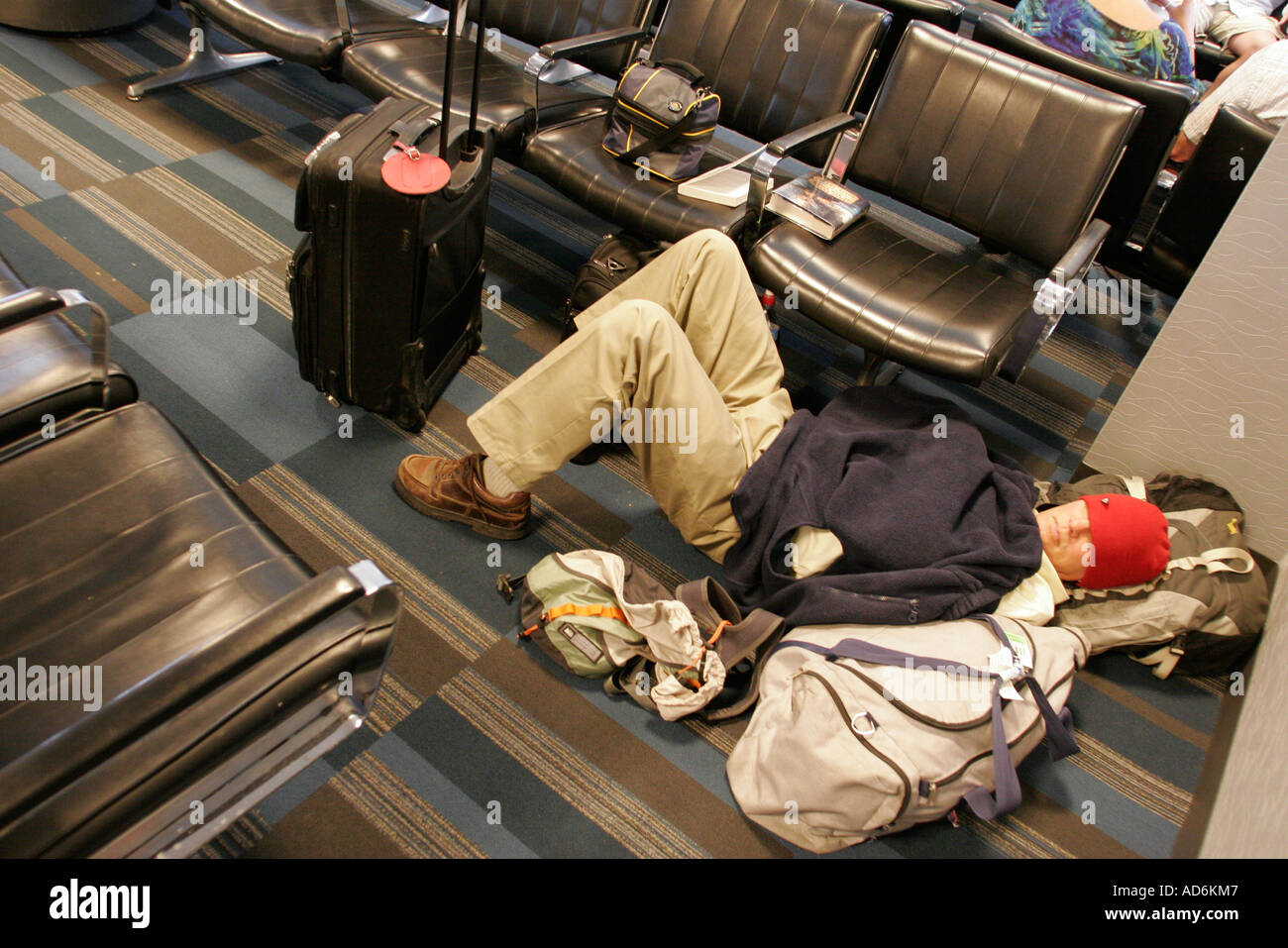 Virginia Loudoun County,Dulles Airport,passenger sleeping,gate,luggage ...