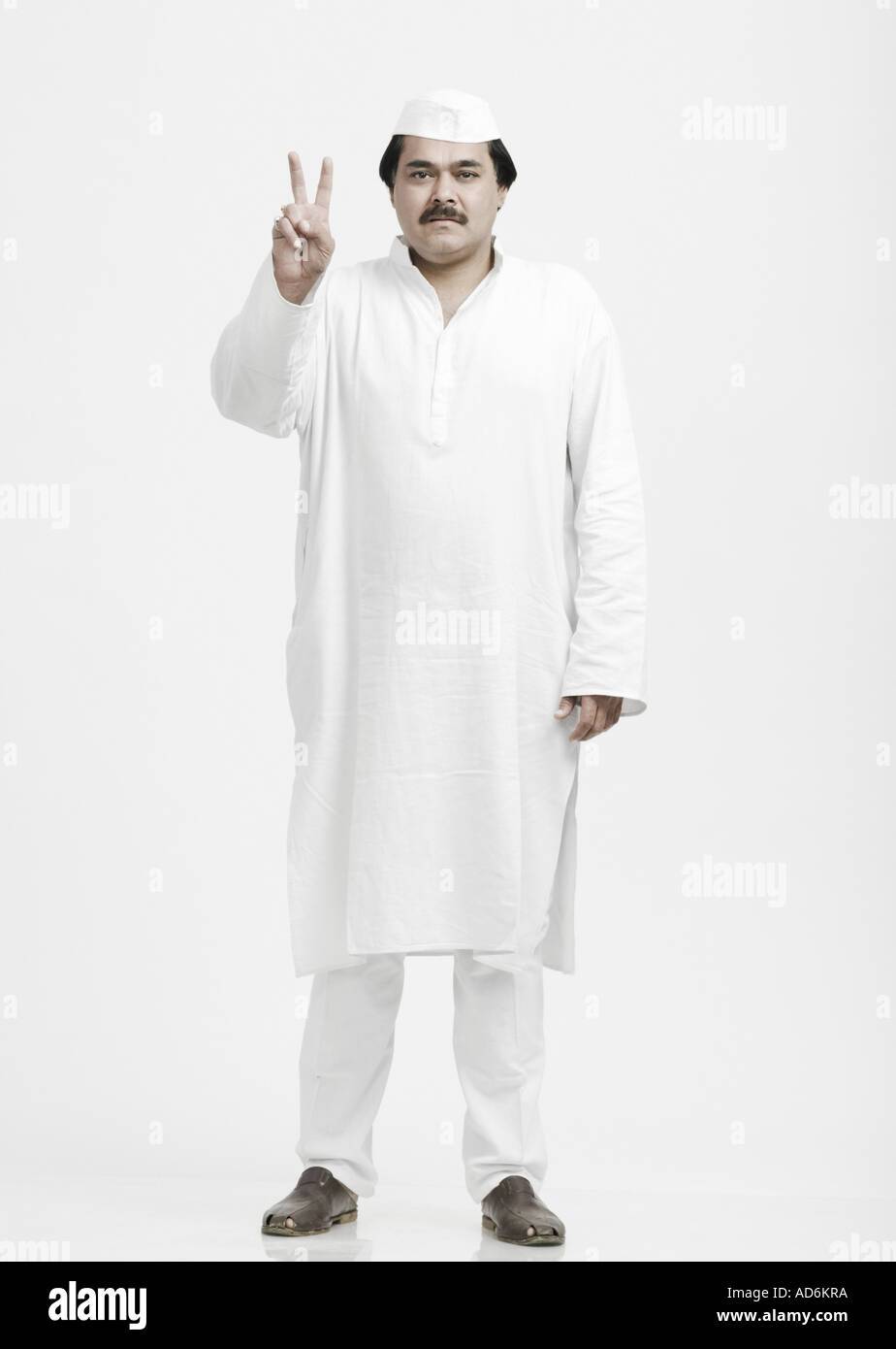Portrait of a male politician showing a peace sign Stock Photo - Alamy