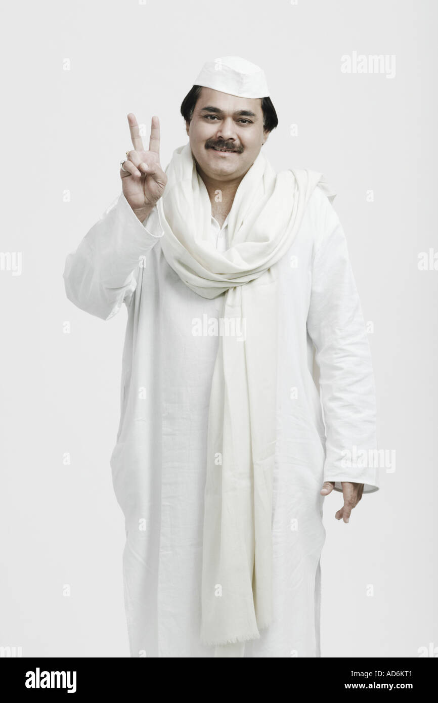 Portrait of a male politician showing a peace sign Stock Photo - Alamy