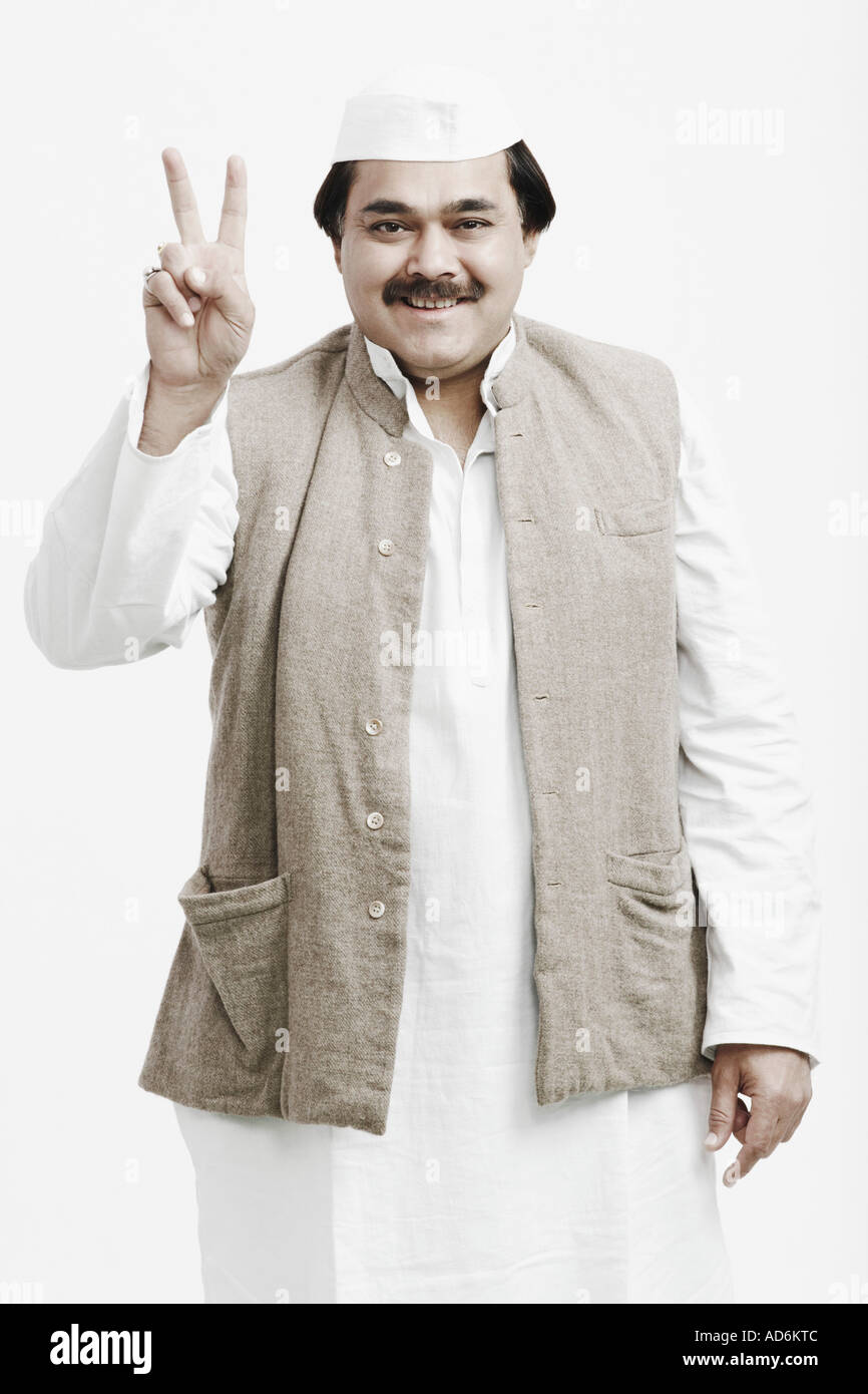 Portrait of a male politician showing a peace sign Stock Photo - Alamy