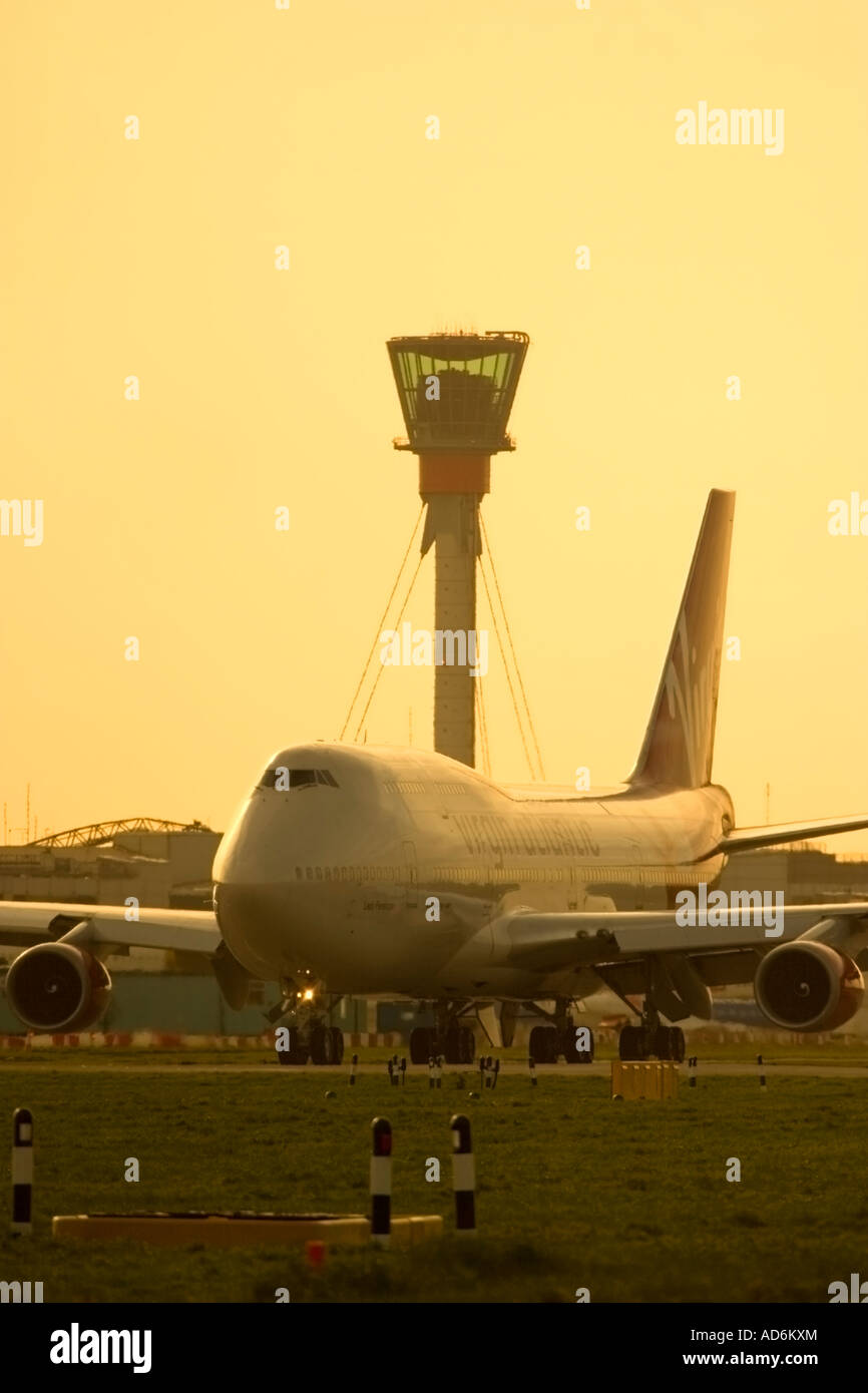 Commercial airliner and new air traffic control tower at London ...