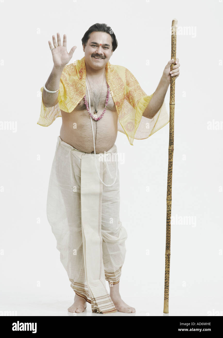 Portrait of a priest holding a stick Stock Photo - Alamy