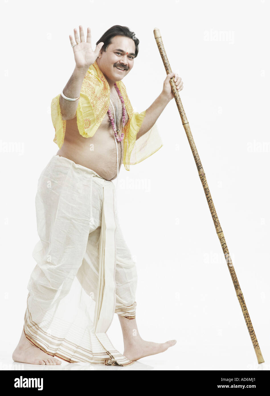 Portrait of a priest holding a stick Stock Photo - Alamy