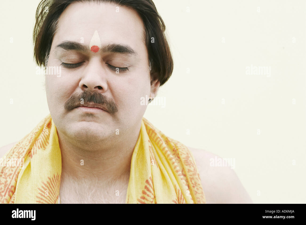 Close-up of a priest praying with his eyes closed Stock Photo - Alamy