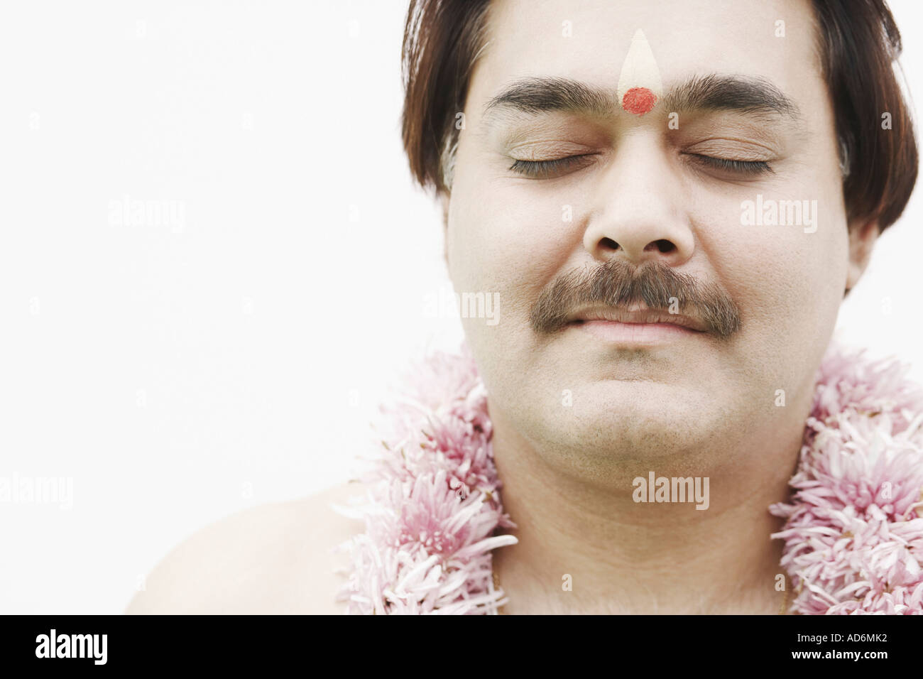 Portrait of a priest thinking with his eyes closed Stock Photo - Alamy