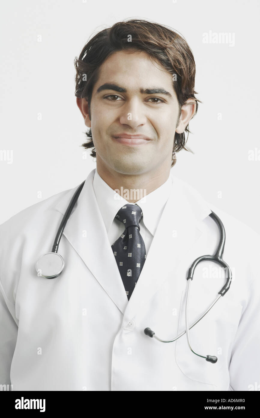 Portrait of a male doctor smiling Stock Photo - Alamy