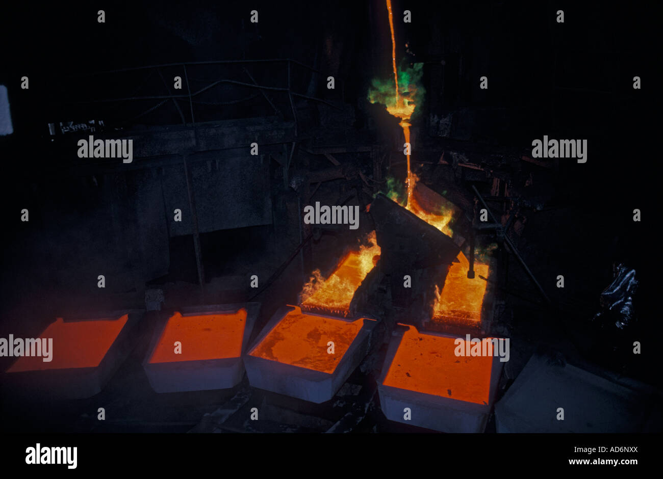 Pouring Molten Copper into anode casts at copper smelter Arizona USA ...