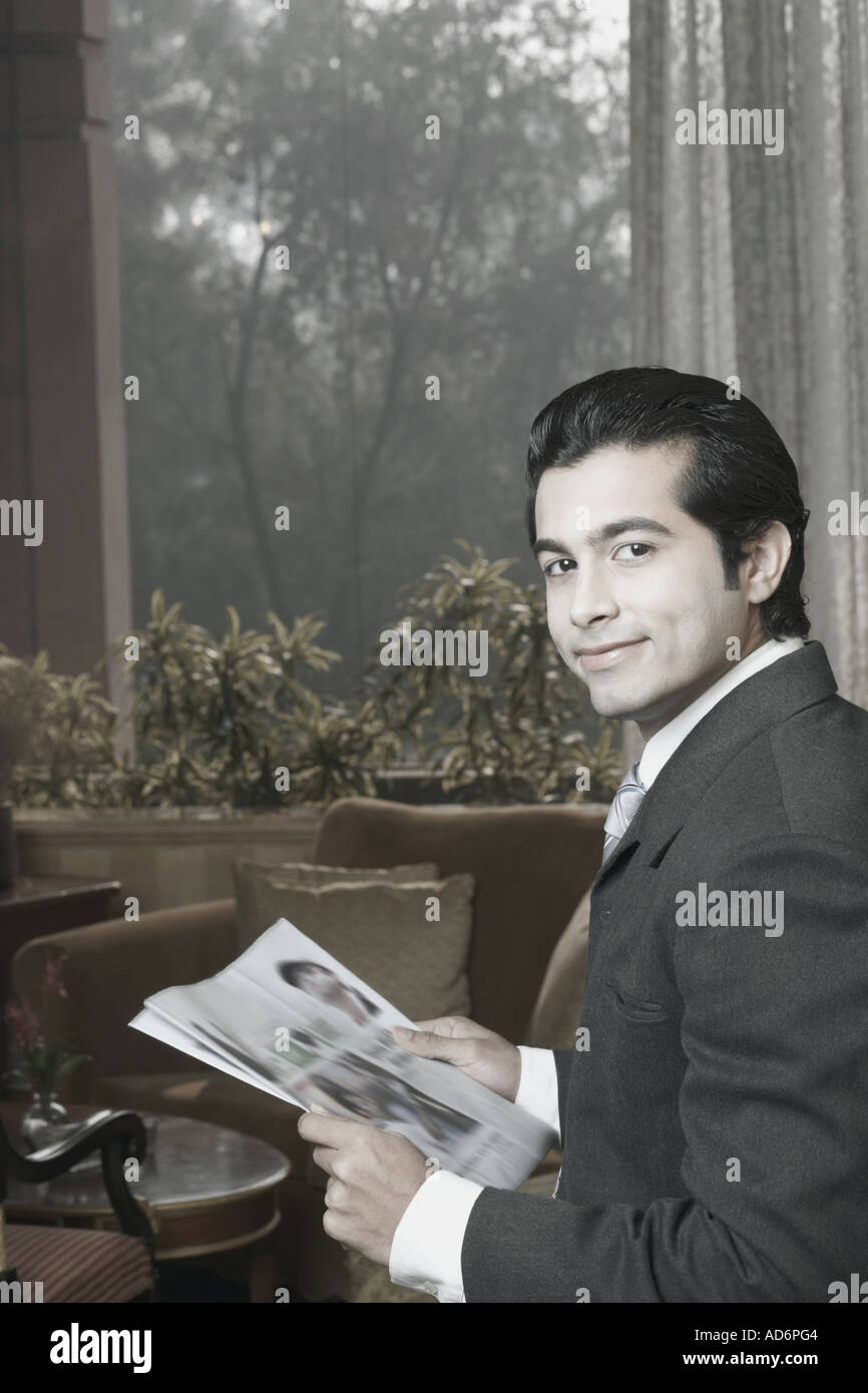 Holding newspaper profile hi-res stock photography and images - Alamy