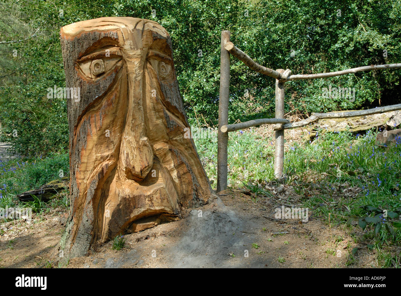 A carved tree trunk in the Enchanted Forest, Groombridge Place Gardens ...